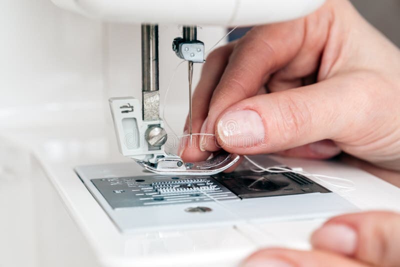 Thread and Threading a Sewing Machine Needle Stock Image - Image of ...