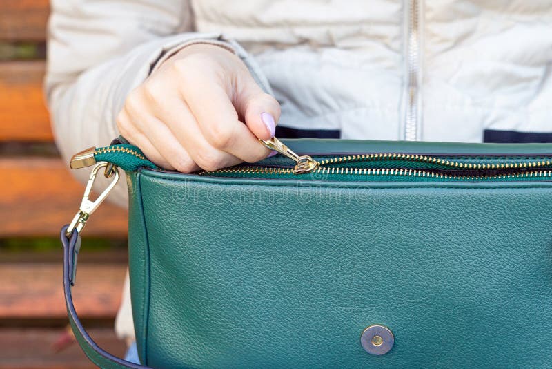 Woman S Hand Opens the Zipper on a Lady S Bag Stock Photo - Image of ...