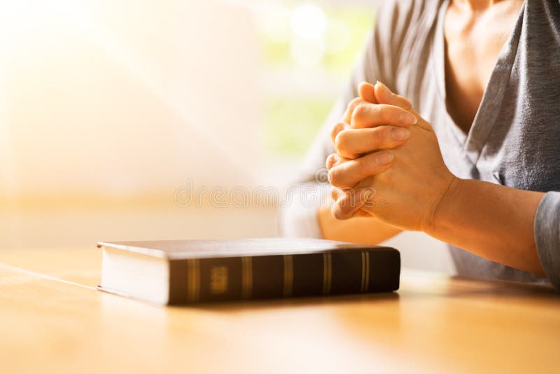 Sunlight Falling on Hand Over Bible Stock Photo - Image of lady ...