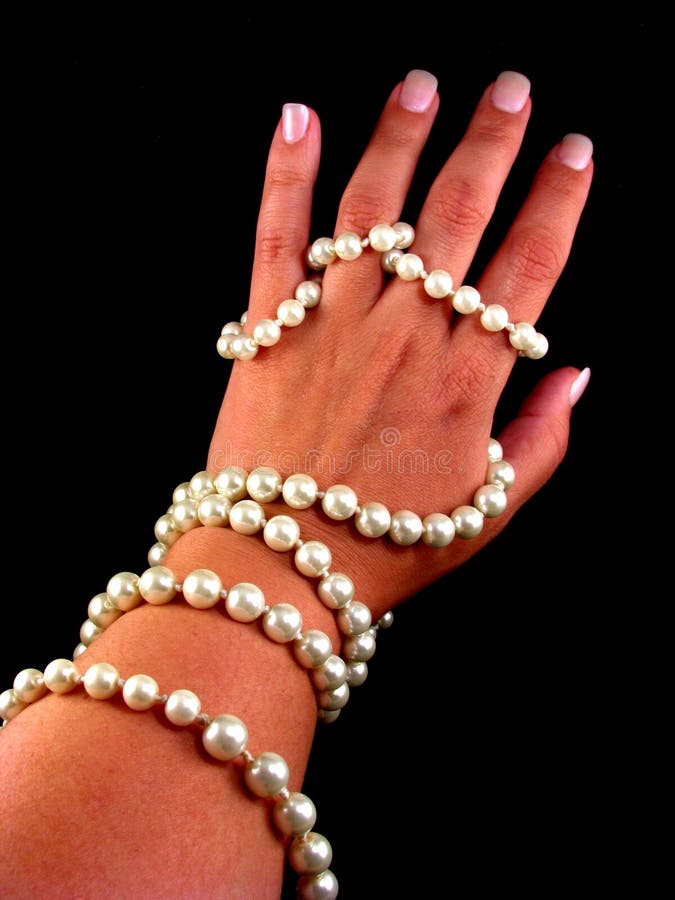 Woman s Hand with Pearls stock photo. Image of nails - 14345208