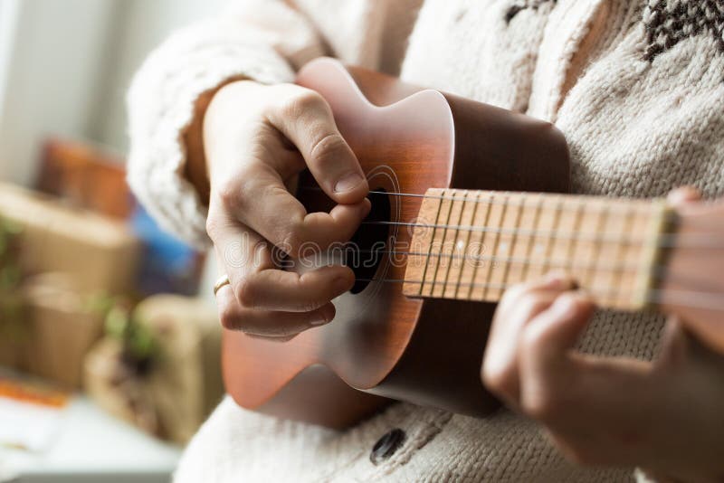 Woman S Hand Playing Ukulele. Stock Image - Image of vintage, acoustic ...