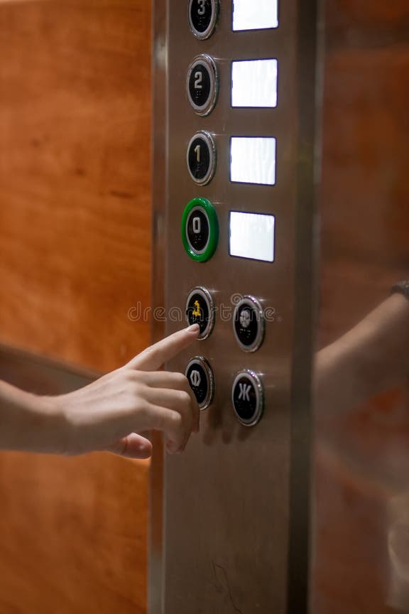 A Woman& X27;s Hand Presses a Button in the Elevator To Call for Help ...