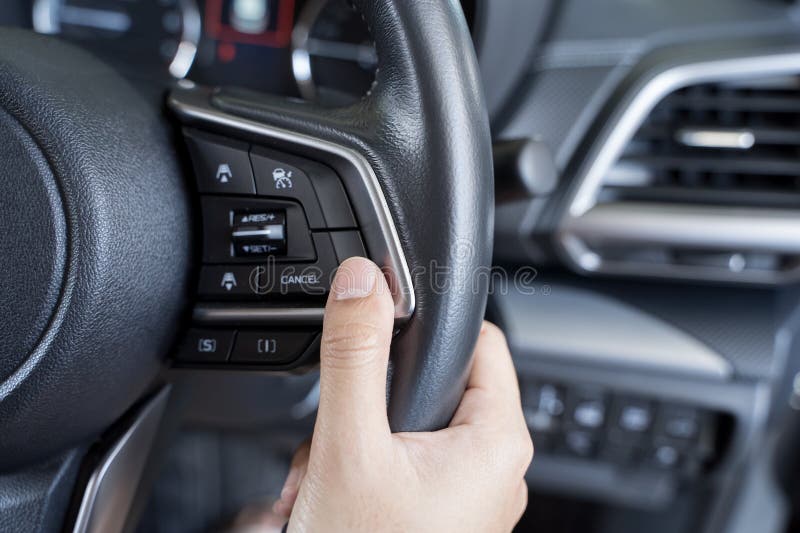 Woman S Hand Presses the Button on the Steering Wheel of the Car Close ...