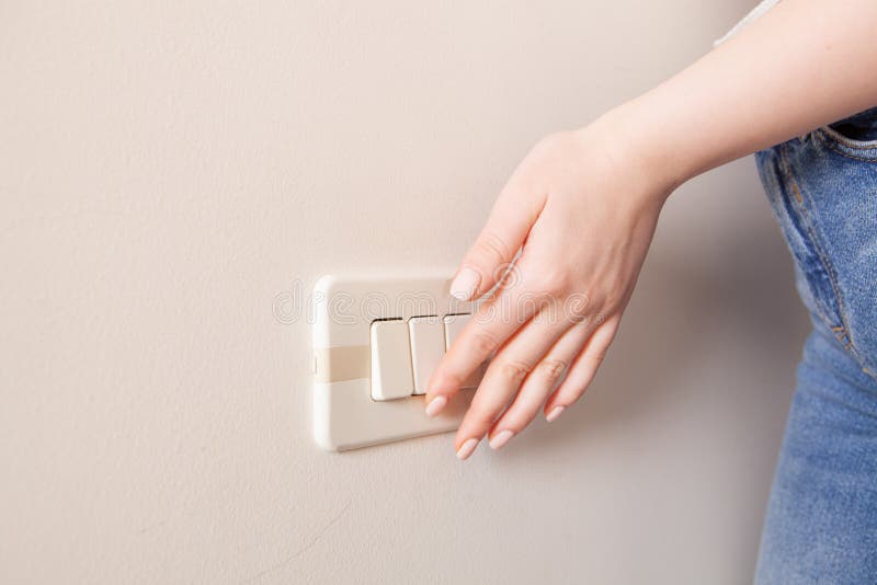 Woman`s Hand Pressing Light Switch at the Wall Stock Photo - Image of ...