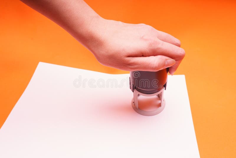 Woman`s Hand with the Seal, Stamp. Process Stamping the Contract ...