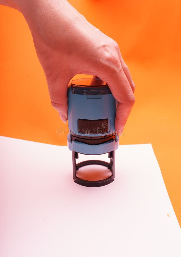 Woman`s Hand with the Seal, Stamp. Process Stamping the Contract ...