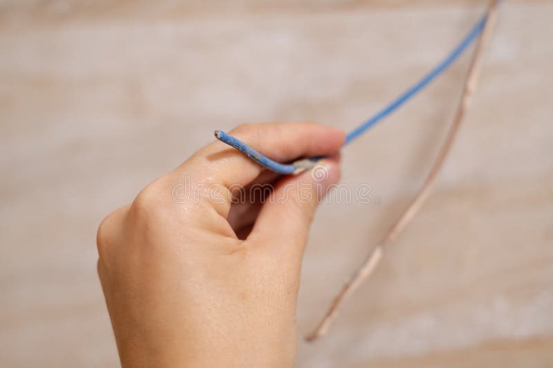 A Woman& X27;s Hand Touches a Bare Wire Stock Image - Image of energy ...