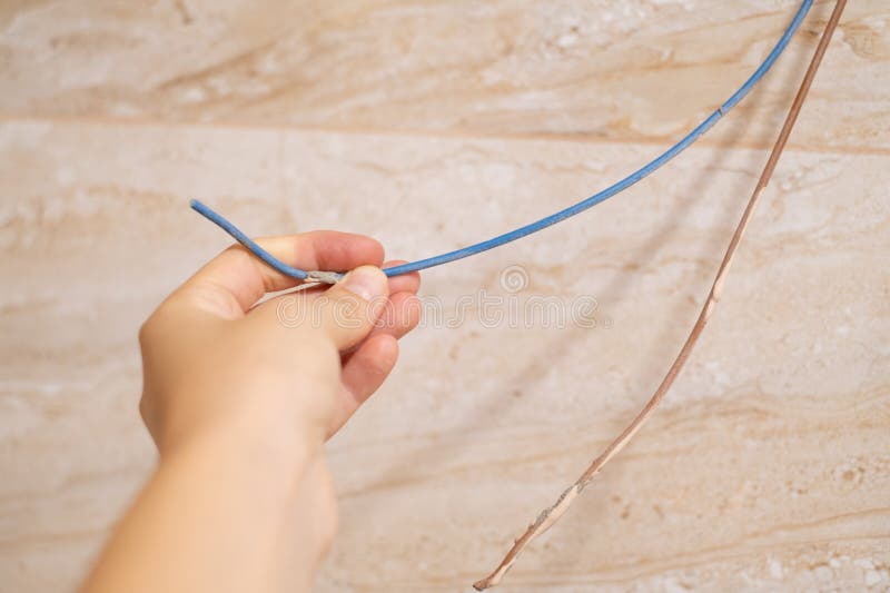 A Woman& X27;s Hand Touches a Bare Wire Stock Photo - Image of issue ...