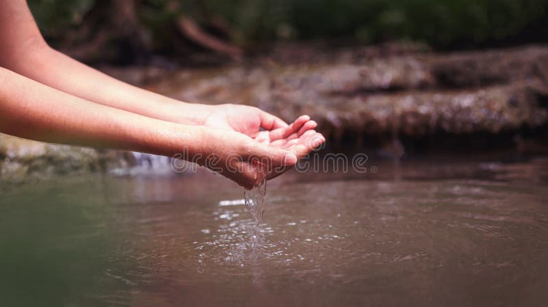 Woman& X27;s Hand Touching Water in the Midst of Nature Stock Photo ...