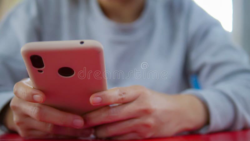 A Woman`s Hand Uses a Smartphone. Using a Mobile Phone I Cannot See the ...