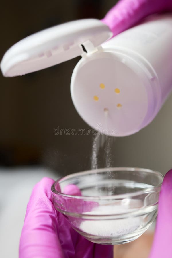 Woman S Hand Using Talcum Powder on Grey Background. Stock Photo ...
