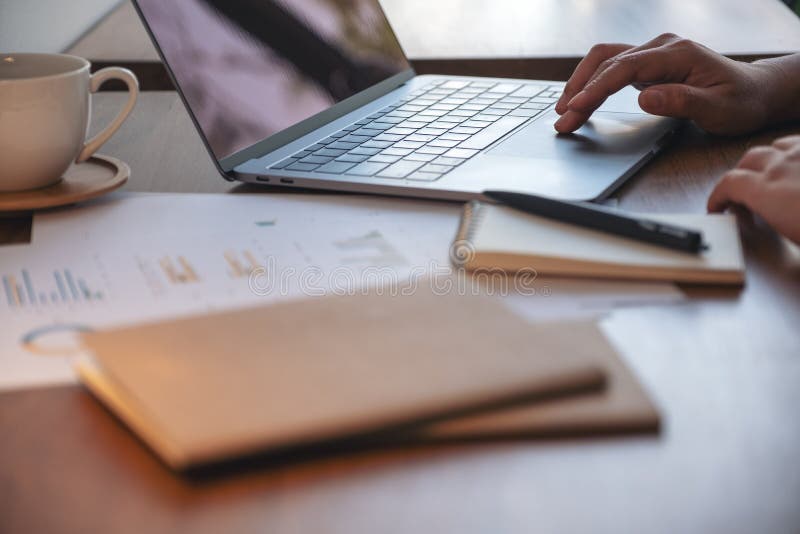 A Woman`s Hand Using and Touching on Laptop Touchpad with Notebooks and ...