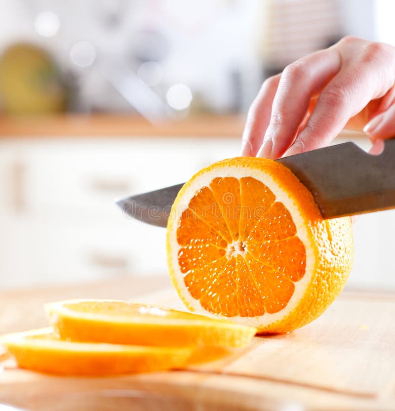 Woman S Hands Cutting Orange Stock Image - Image of lifestyles ...