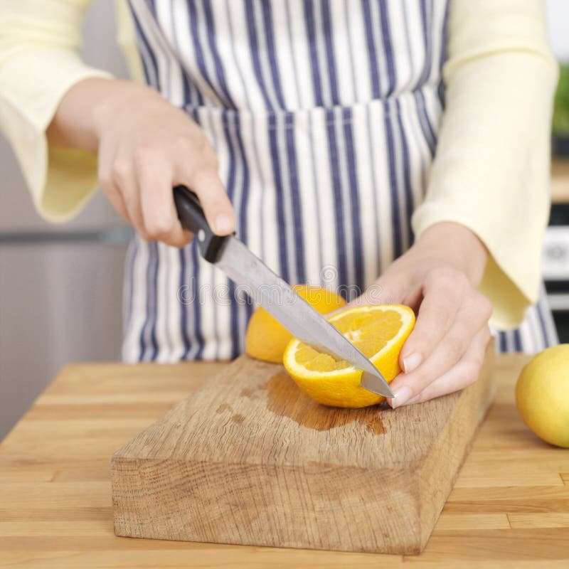 Cutting an Orange To Make Fresh and Healthy Orange Juice. Healthy ...