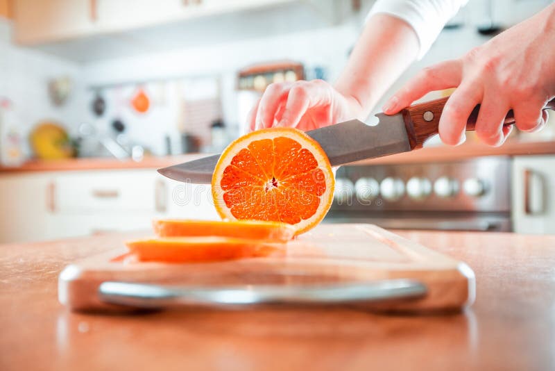 Woman S Hands Cutting Orange Stock Photo - Image of finger, close: 58209554