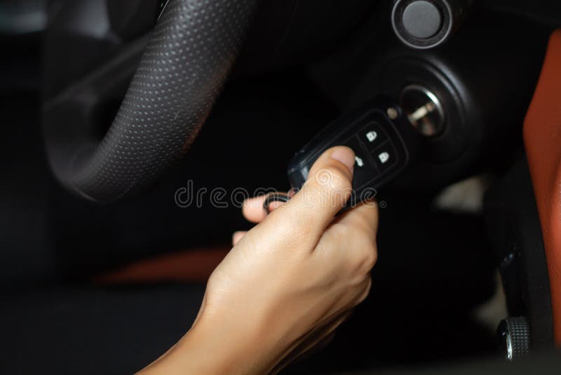 Woman`s Hands Hold the Key for Starting the Car,selective Focus on Hand ...