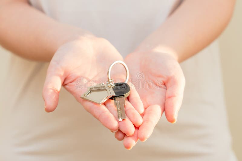 Woman S Hands Holding Key with Keychain in Shape of the House Stock ...