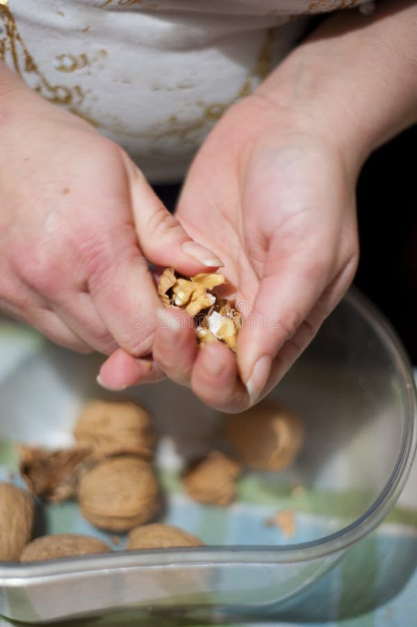 Woman Open Up Pecan Nuts in a Bowl Stock Photo - Image of nature, heart ...