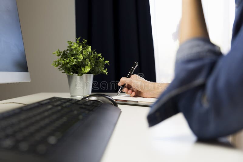 Woman`s Hands with Pen Writing on Notebook. Modern Grey Office D Stock ...