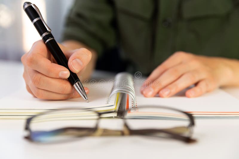 Woman`s Hands with Pen Writing on Notebook. Modern Office Desk Stock ...