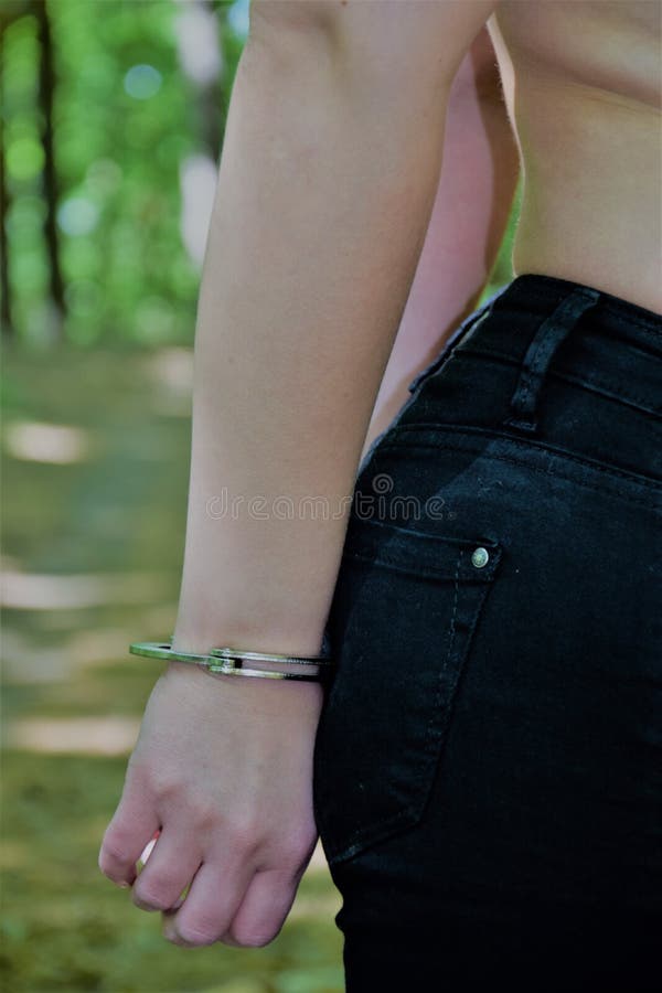 Woman`s Hands Shackled in the Back Stock Image - Image of danger, crime ...
