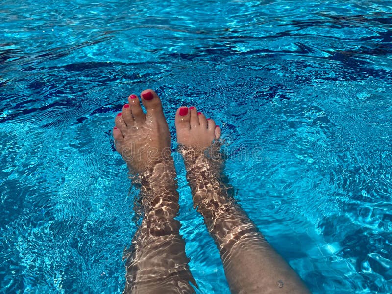 Woman`s Legs Over the Swimming Pool Stock Image - Image of horizontal ...