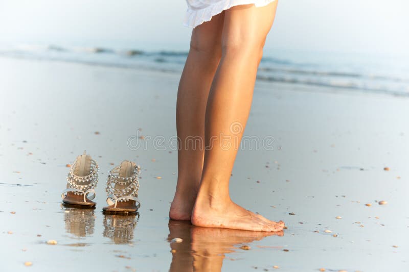 Woman S Legs and Shoes with Ocean Stock Image - Image of ocean, female ...