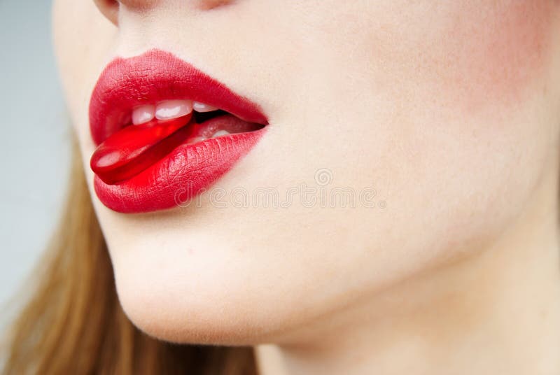 Woman S Lips Biting a Red Jelly Stock Photo - Image of licking, detail ...
