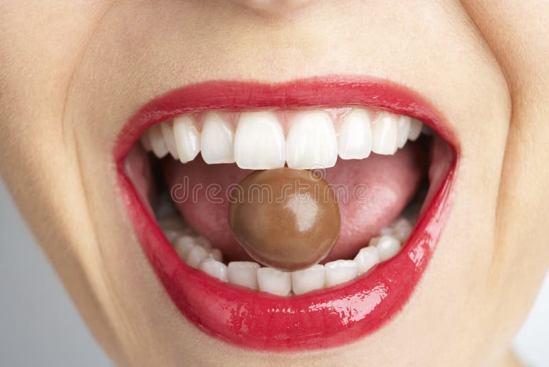 Woman S Mouth Biting on Chocolate Stock Photo - Image of glamorous ...