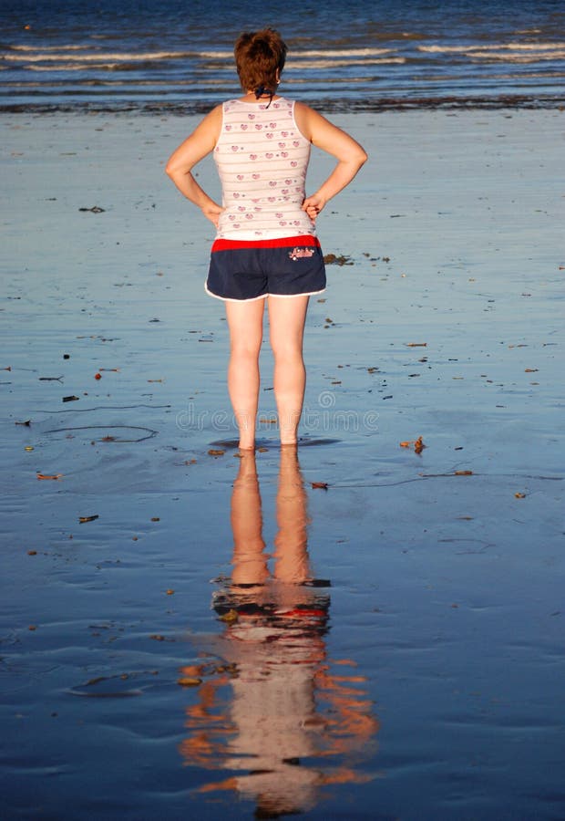 Woman S Reflection in Wet Sand on Australian Beach Stock Photo - Image ...