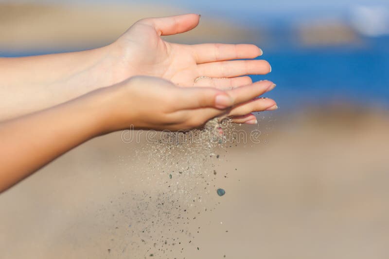 Woman with Sand Falling through Her Hands Stock Image - Image of carefree, coastline: 34523479