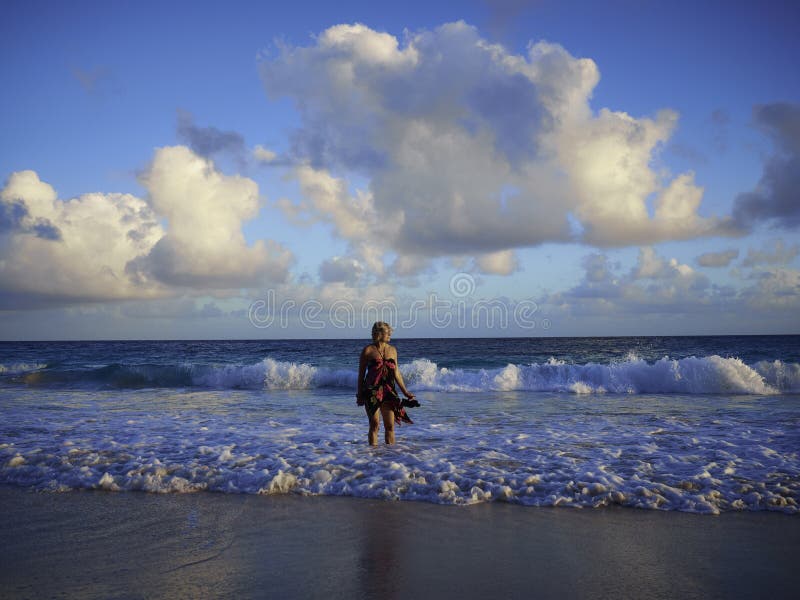 Woman on a Sandy Beach on a Cloudy Day Stock Photo - Image of cloudy ...