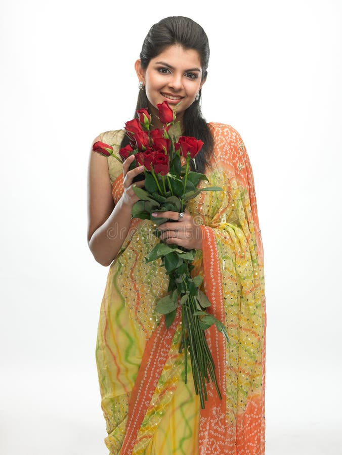 Woman in Sari Holding Red Roses Stock Photo - Image of fancy, jewelery ...