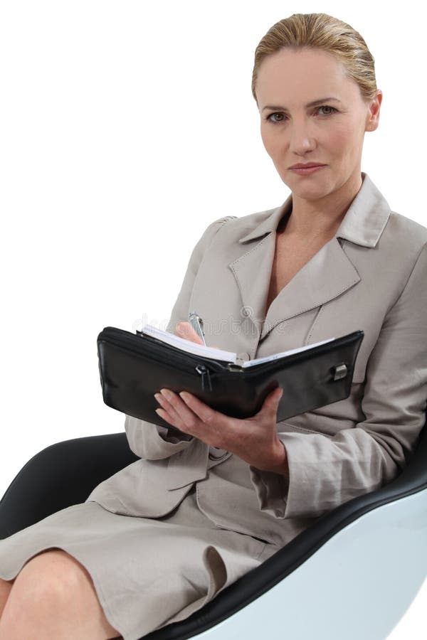 Woman sat taking notes stock image. Image of notes, schedule - 28905881