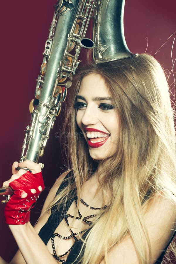 Woman with saxophone stock photo. Image of pretty, talent - 69954974