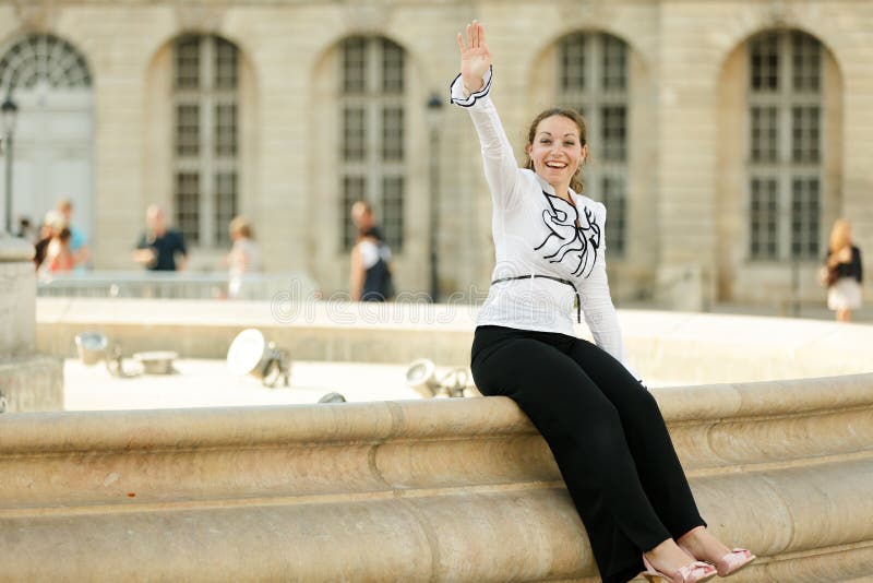 Woman saying hello stock image. Image of pant, elegant - 15301213