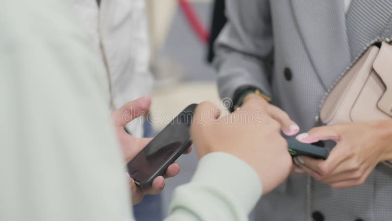 Woman Scans QR Code on Friend Phone Screen in Office Stock Footage ... Woman Scans QR Code on Friend Phone Screen in Office Stock Footage ...