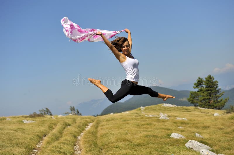 Woman with a Scarf in Attractive Jumping Pose Stock Image - Image of ...