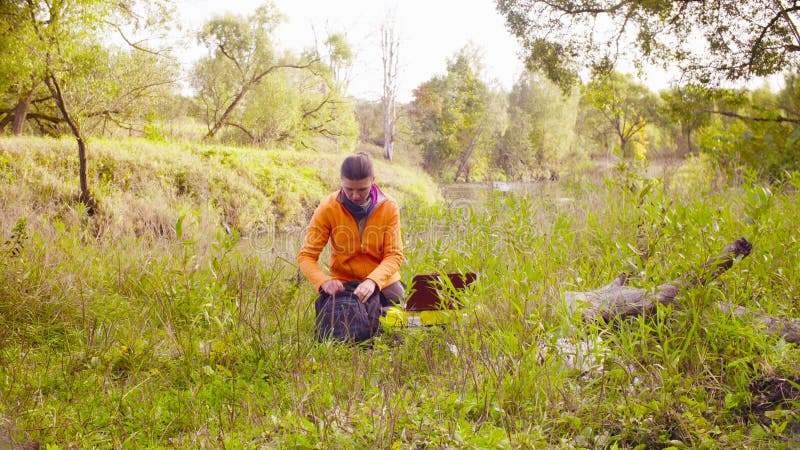 Scientist Ecologist Taking a Water Sample and Reading Ph Value at River ...