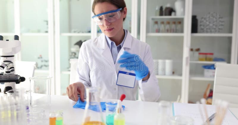 Woman Scientist Puts on Gloves before Conducting Experiment Stock Video ...