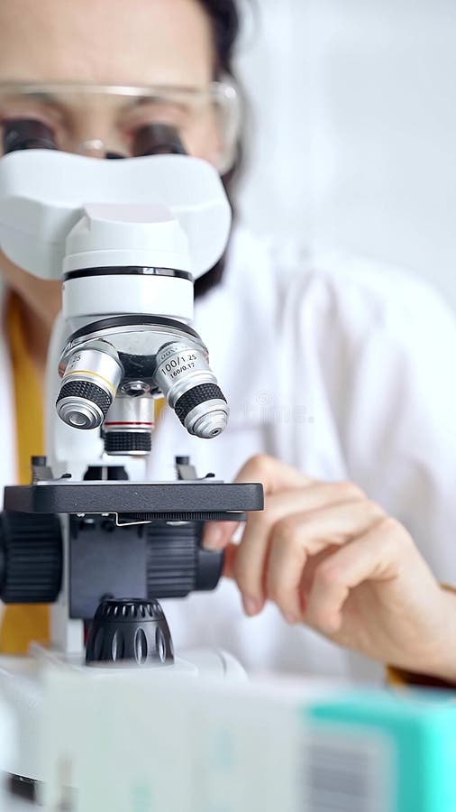 Woman Scientist Using Microscope in Laboratory. Microbiology Science ... Woman Scientist Using Microscope in Laboratory. Microbiology Science ...