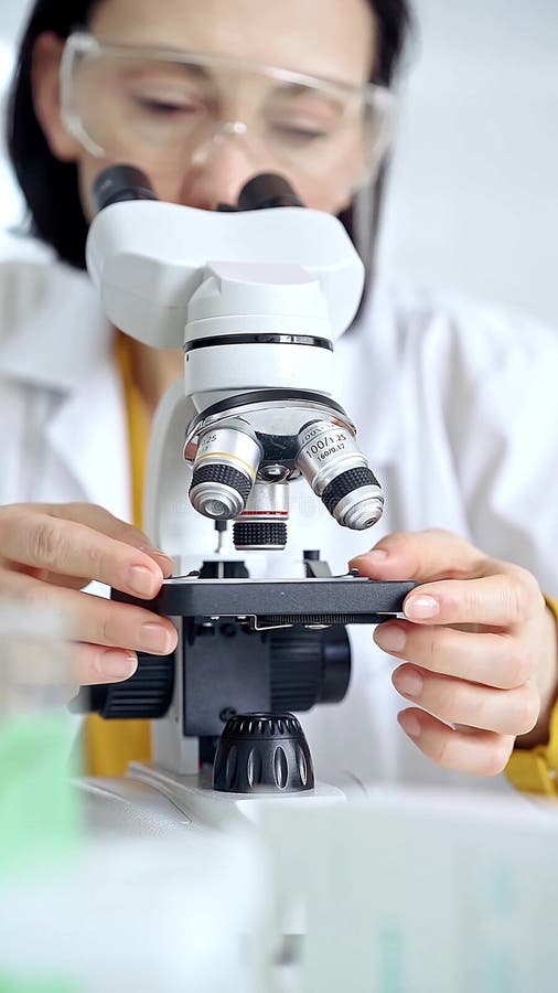 Woman Scientist Using Microscope in Laboratory. Microbiology Science ...
