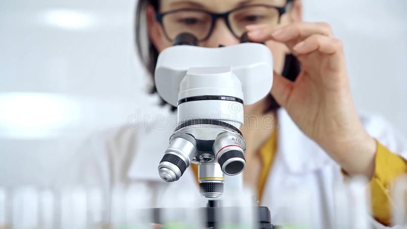 Woman Scientist Using Microscope in Laboratory. Microbiology Science ...
