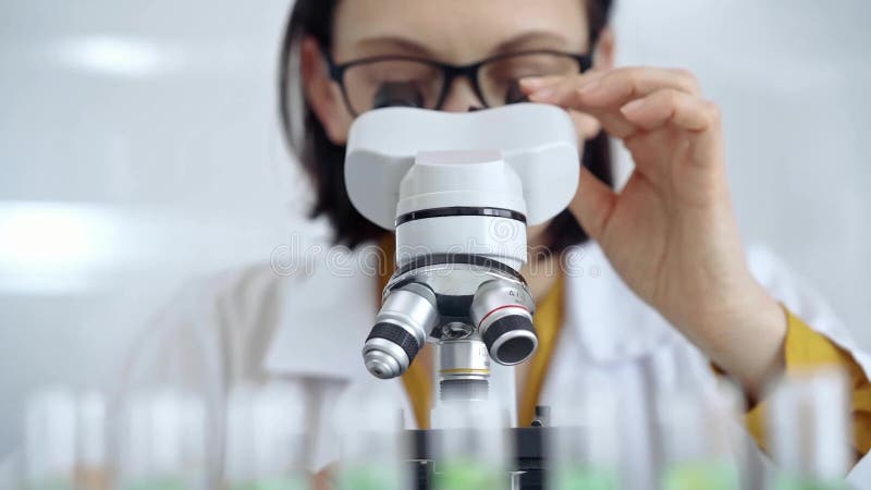 Man Scientist is Using Microscope in Laboratory. Microbiology Science ...