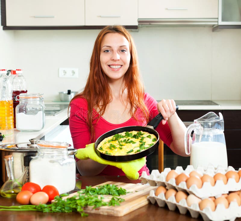 Woman with scrambled eggs stock photo. Image of cooking - 52212274