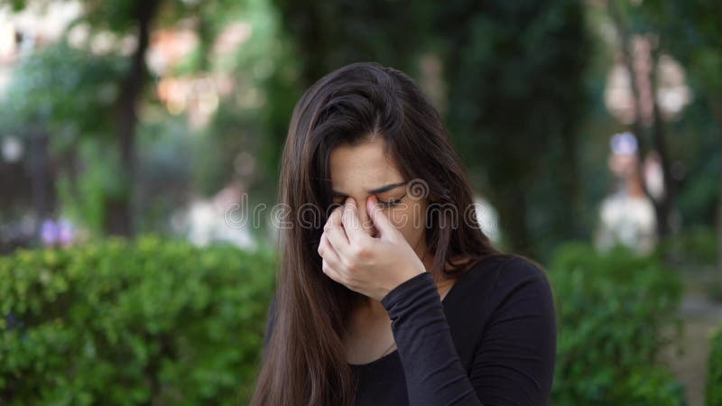 Woman Scratching Itchy Eyes in a Park. Woman Suffering Itching ...