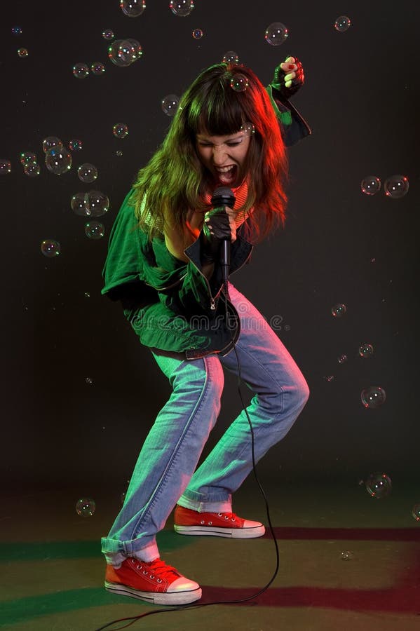 Woman screaming in mike stock image. Image of karaoke - 5572029