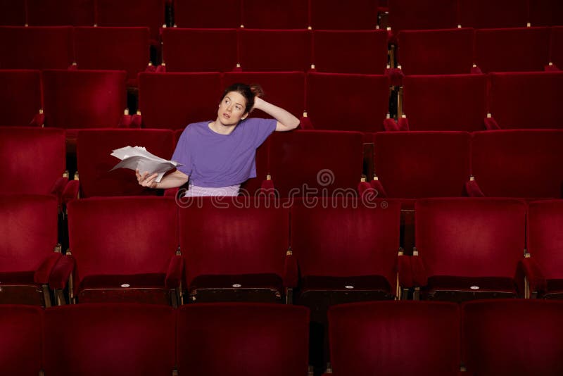 Woman with Script at Theatre Stall Stock Photo - Image of bored, seat ...