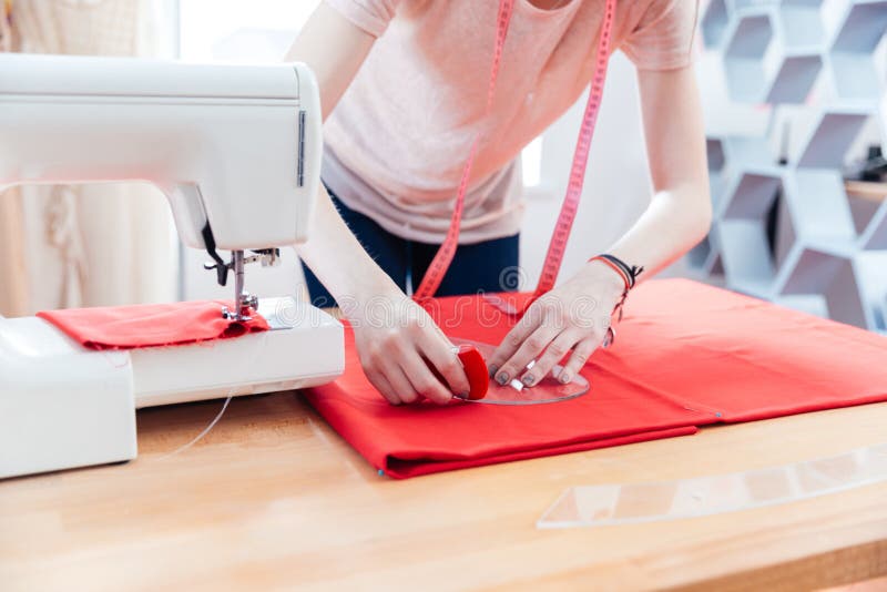 Woman Seamstress Working Making Pattern on Red Fabric Stock Photo ...