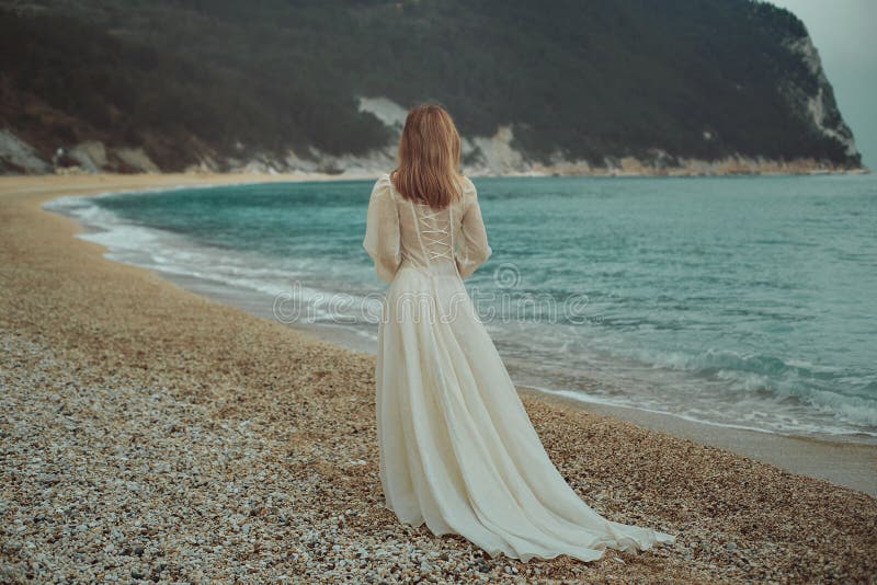 Woman on the seaside stock photo. Image of imagination - 190757154